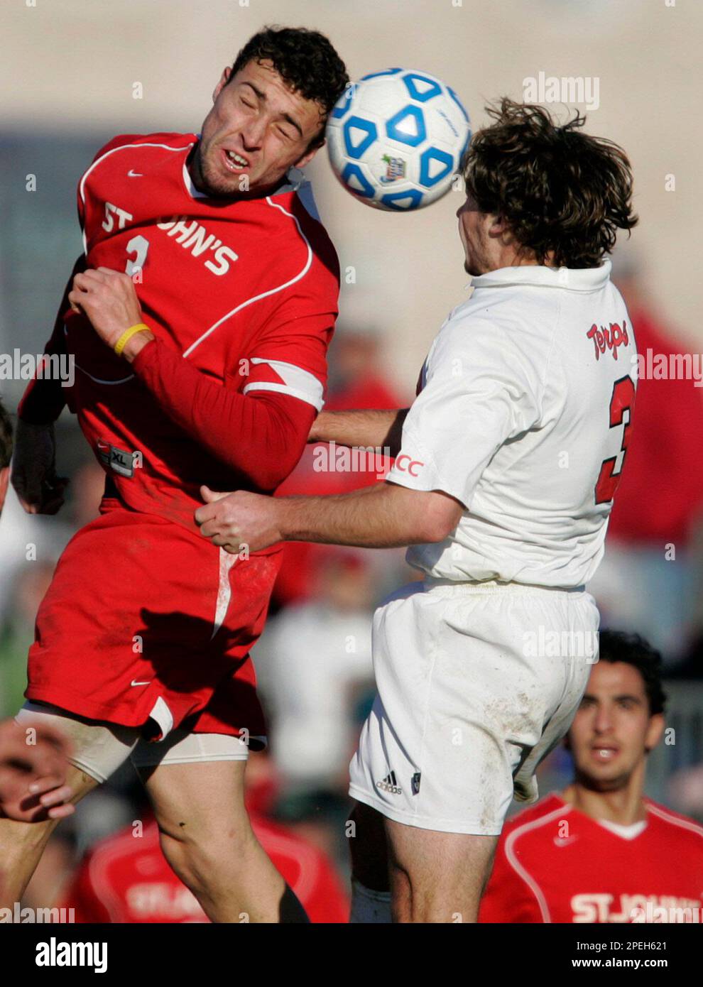 St. John's midfielder Andre Schmid, left, and Maryland defenseman Ian ...