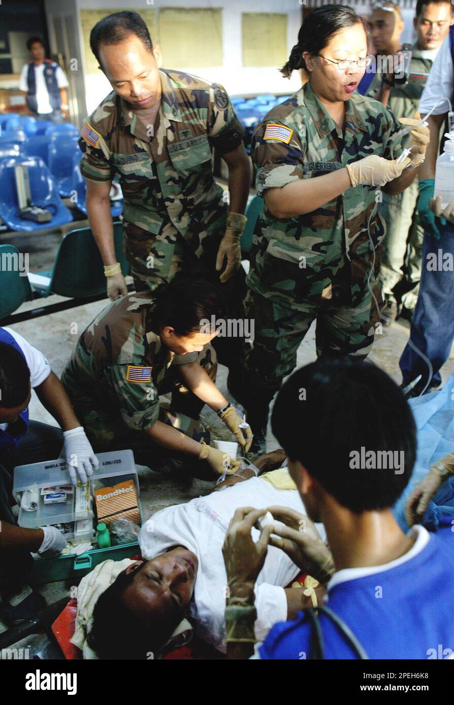 A U.S. Army reserve medical team treats a typhoon victim at the ...