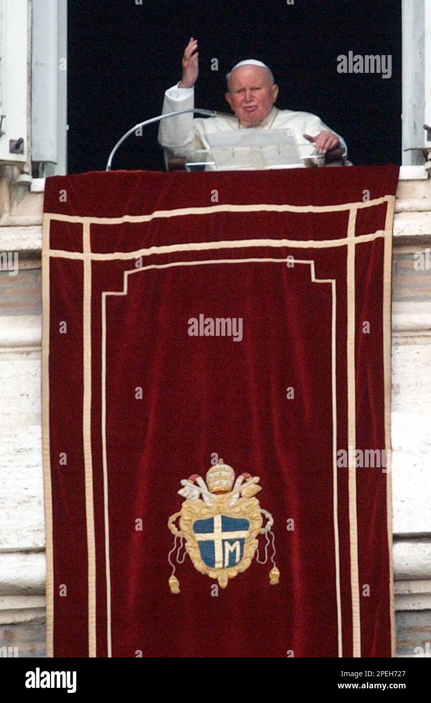 Pope John Paul II gives his blessing during the Angelus prayer in St ...