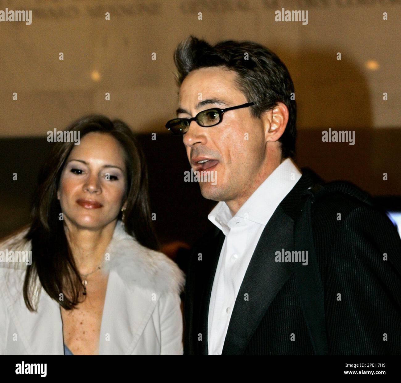 Actor and singer Robert Downey Jr., with Susan Levin, left, arrives for ...