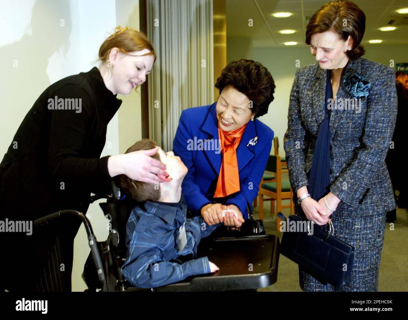 The wife of Britain's Prime Minister, Cherie Blair, right, and wife of ...