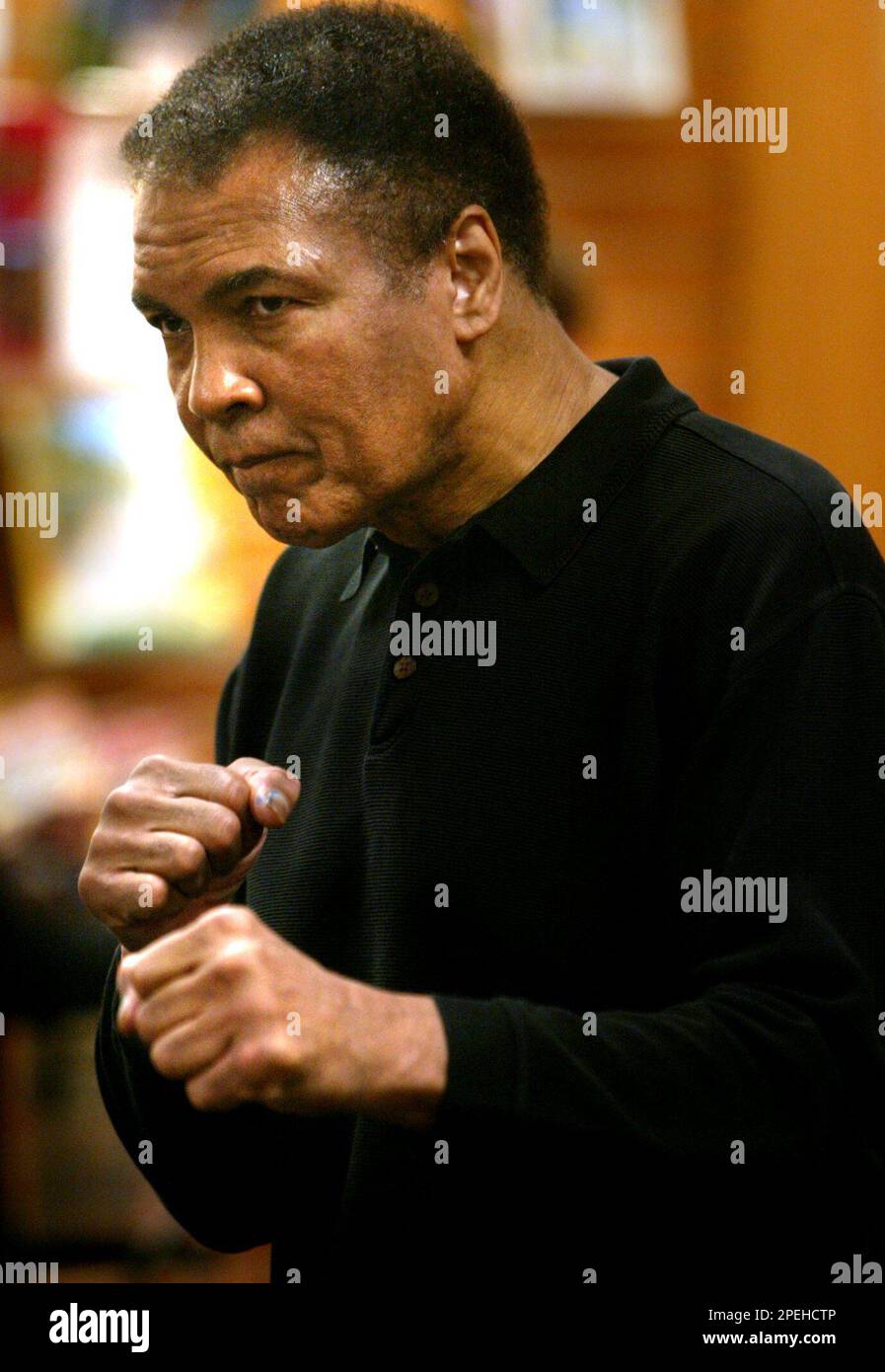 Muhammad Ali poses as he arrives to promote his latest book, "The Soul ...