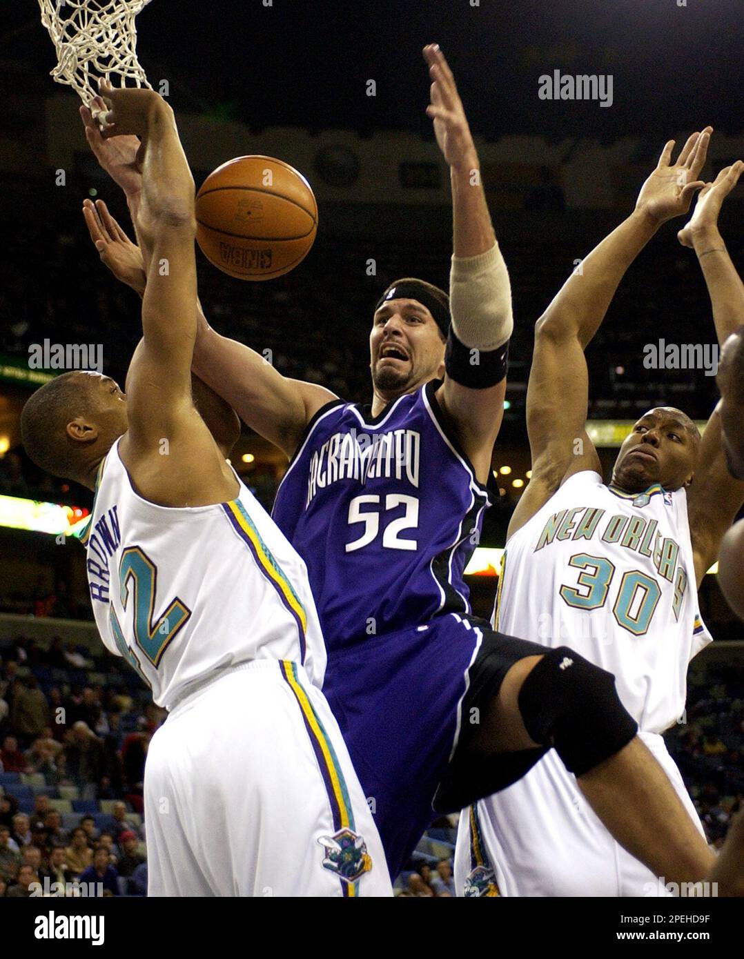 Sacramento Kings center Brad Miller (52) struggles for a rebound with ...