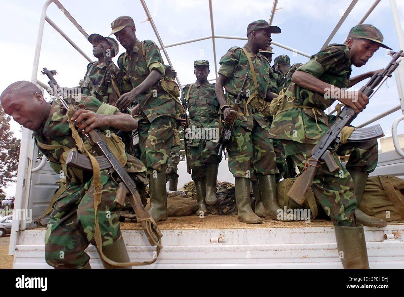 ** FILE ** Rwandan soldiers jump off a truck in the eastern Congolese ...