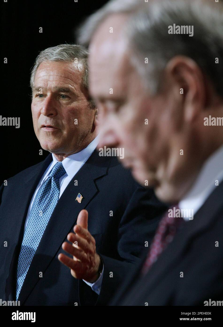 U.S. President George W. Bush (left) speaks as Canadian Prime Minister ...