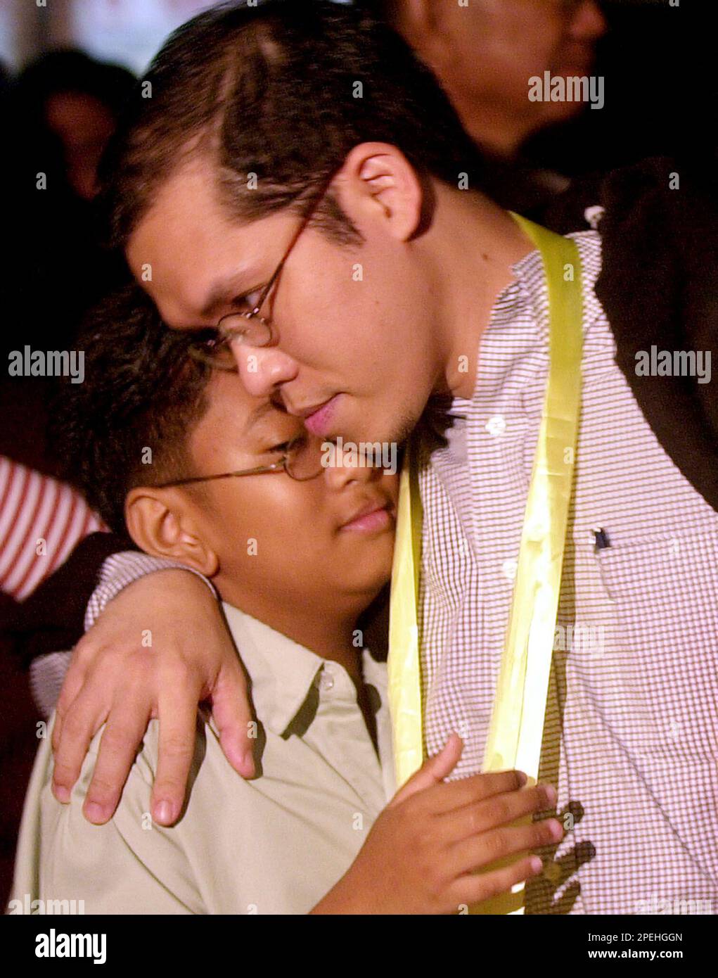 Freed Filipino hostage Angelito Nayan,right, embraces a relative as he ...