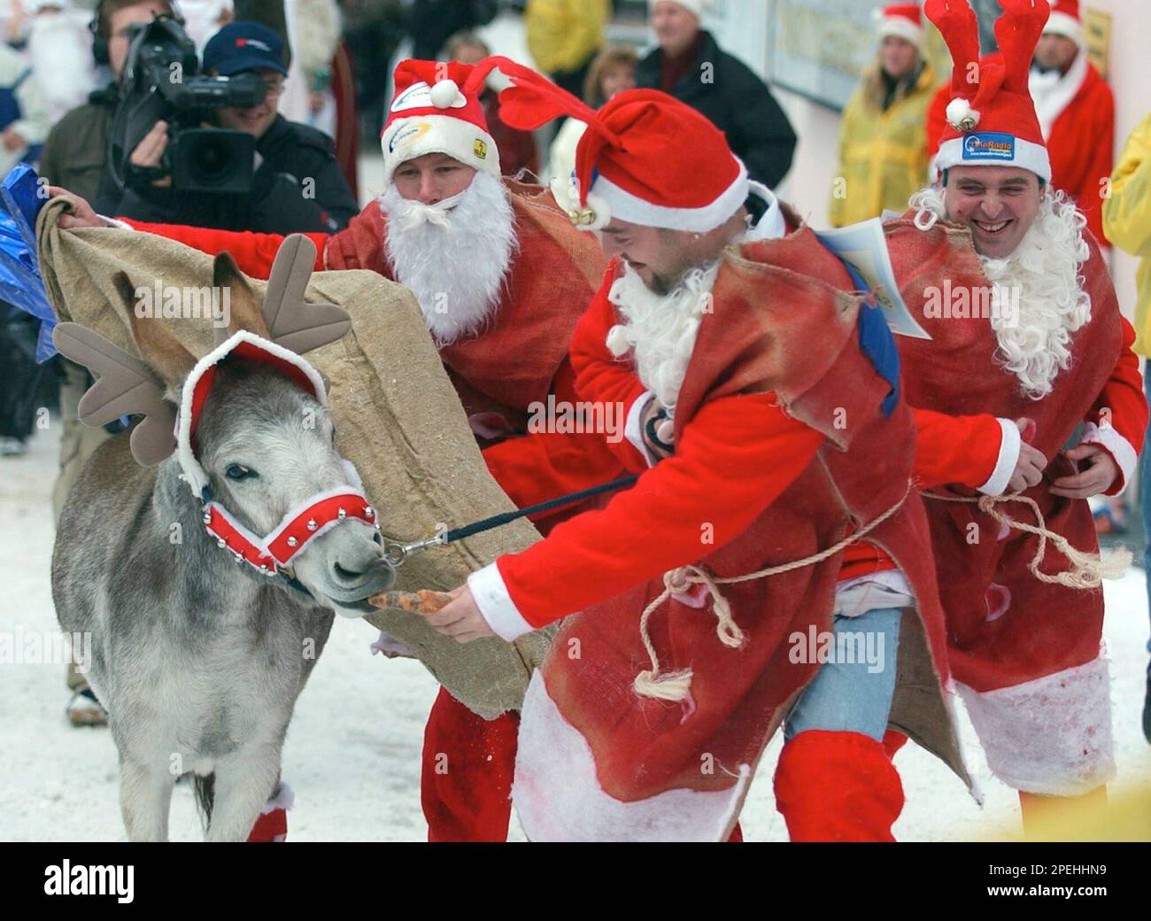 Participants of the fourth Santa Claus World Championships push a ...