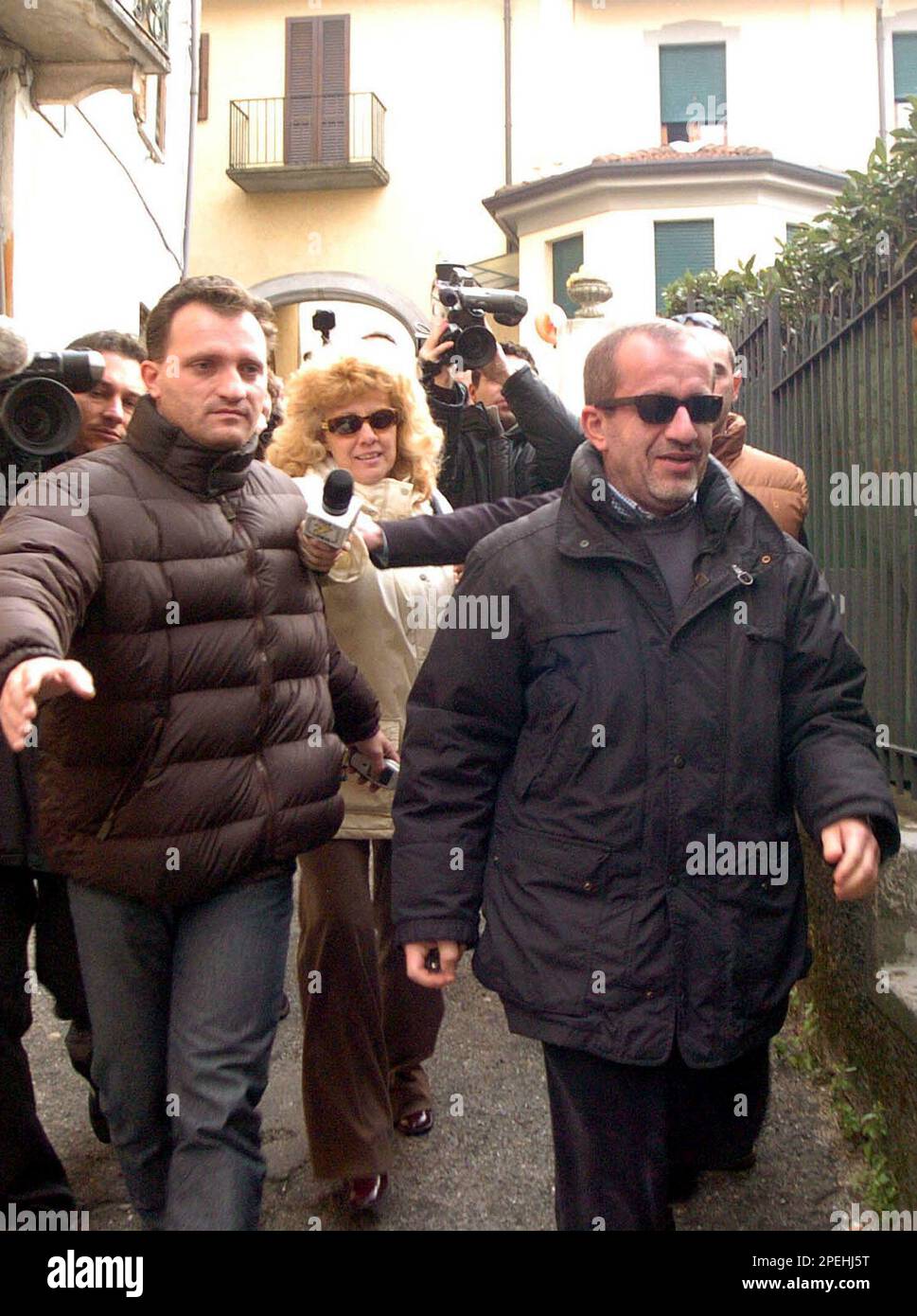 Roberto Maroni receives media attention as he leaves the house of ...