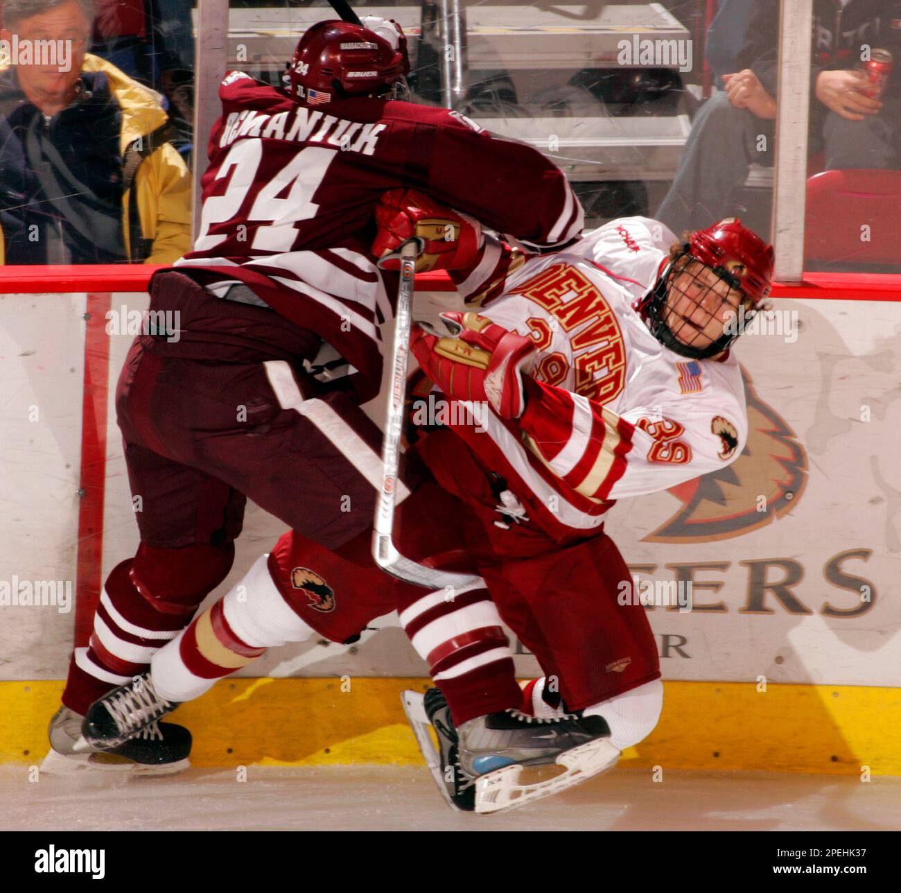 Massachusetts defensemen Dusty Demianiuk (24) checks Denver left winger ...
