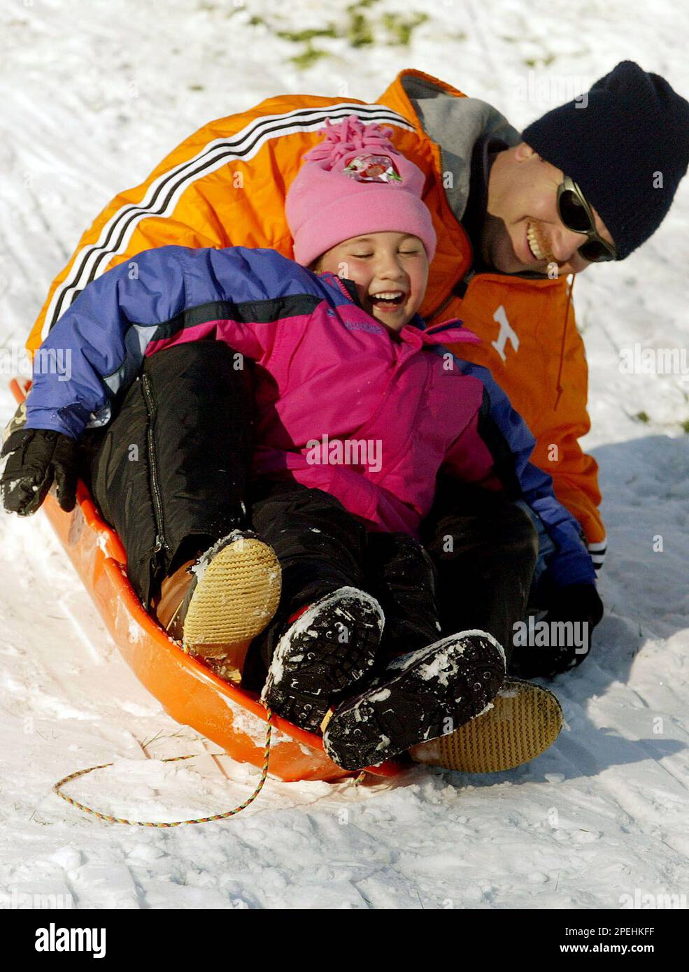 Dave Durbala and his daughter Gretchen, 5, smile as they tip over ...