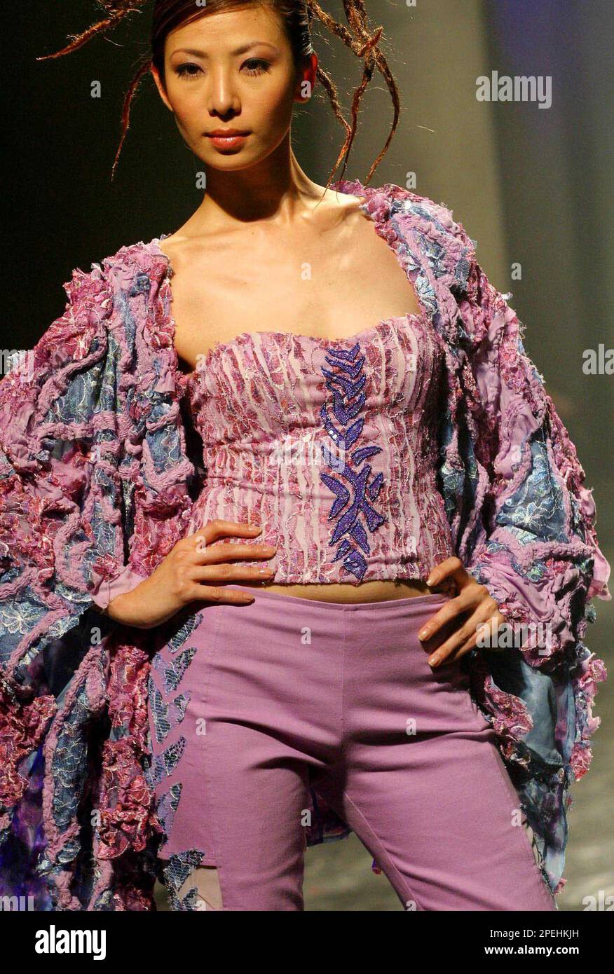 A model presents an outfit designed by Indonesia's famous designer Ika ...