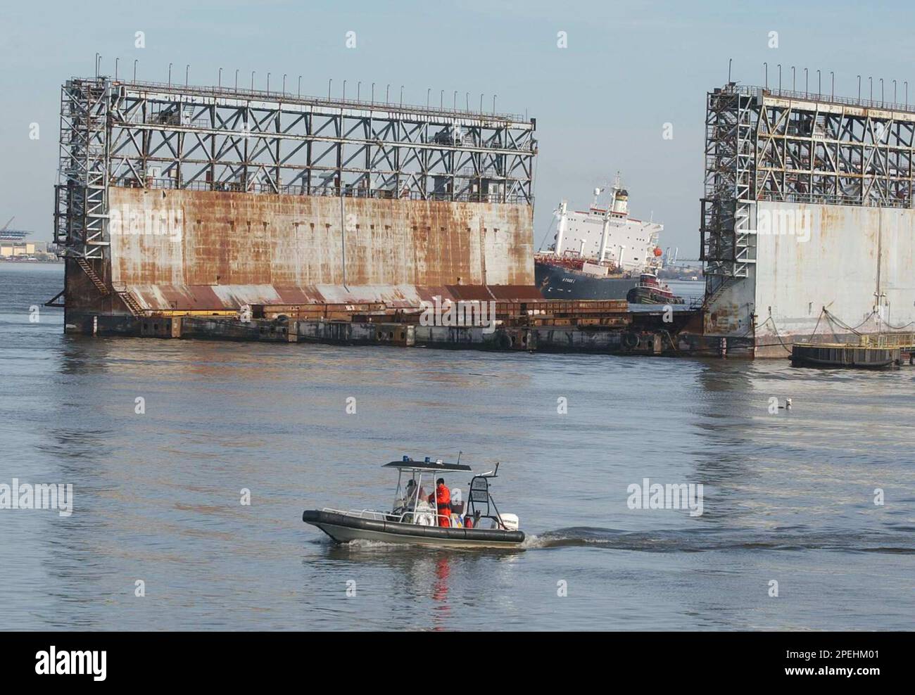 New Jersey state police, foreground, patrol for an oil spill near the ...