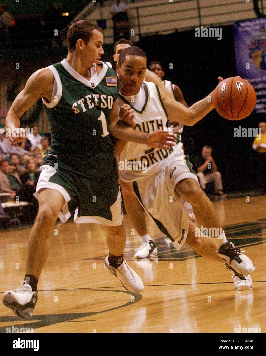 South Florida guard Brian Swift (3) muscles around Stetson guard Gabe ...