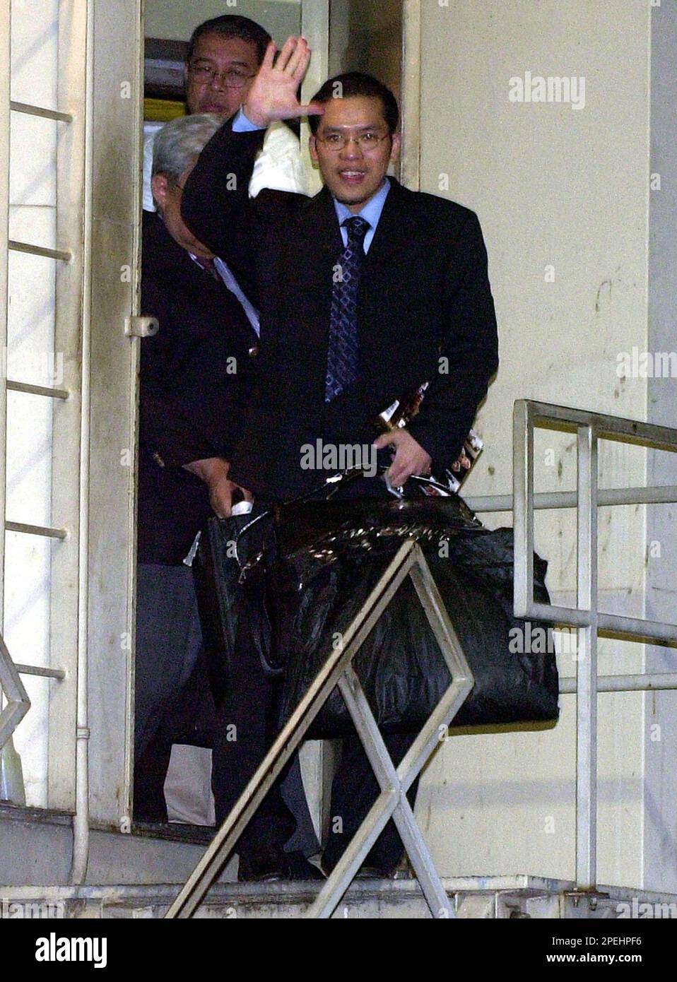 Released hostage Filipino diplomat Angelito Nayan waves before ...