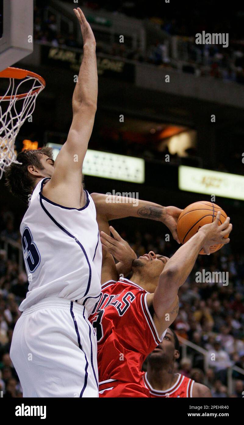 Utah Jazz forward Mehmet Okur (13),of Turkey, fouls Chicago Bulls ...