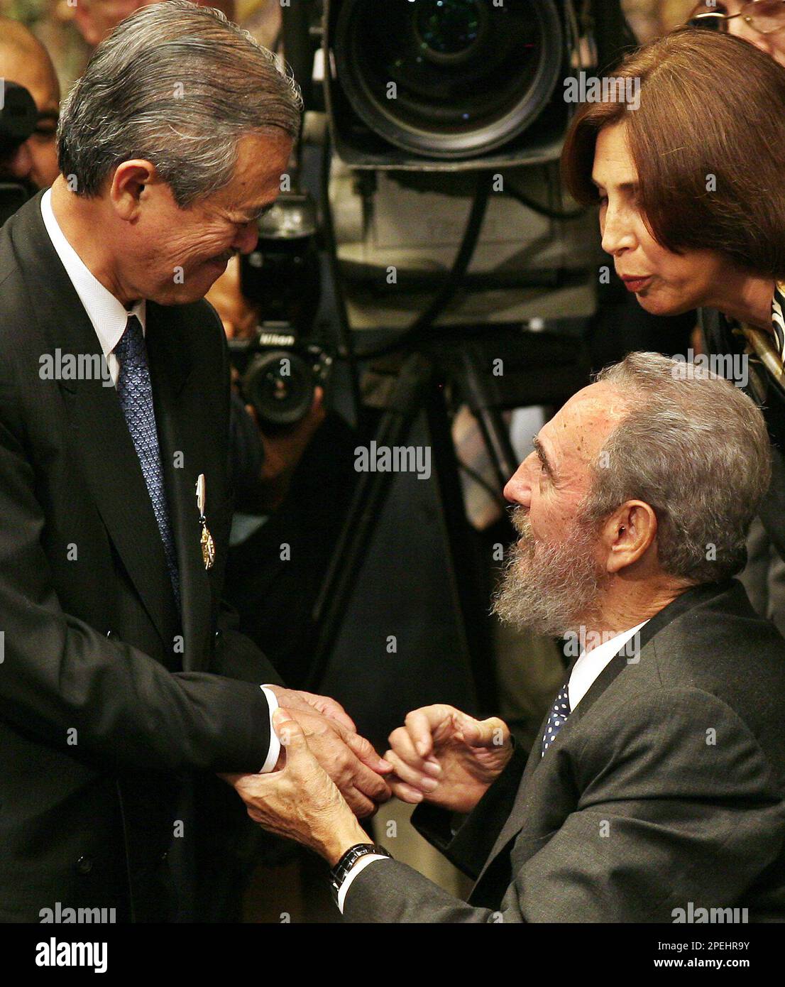 Cuban President Fidel Castro, right, congratulates Malaysian Prime ...