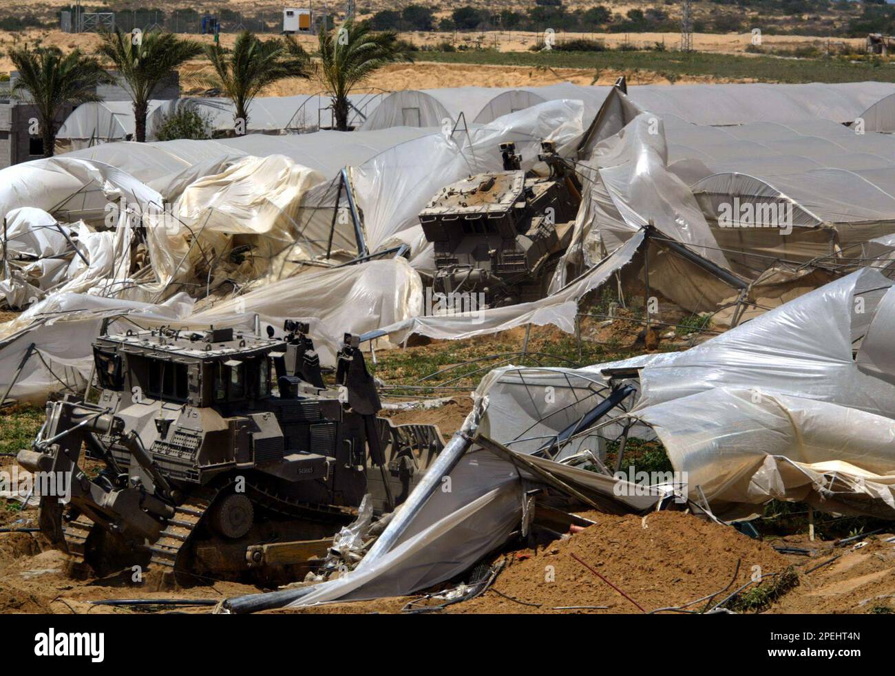 ** FILE ** Israeli army D-9 bulldozers demolish greenhouses and farming ...