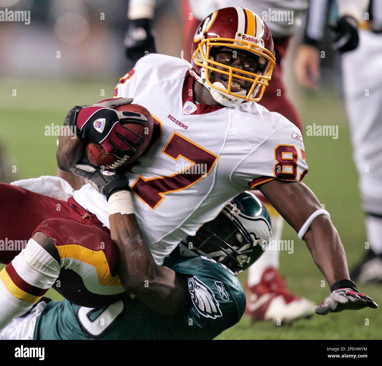 Washington Redskins wide receiver Rod Gardner (87) is taken down by ...