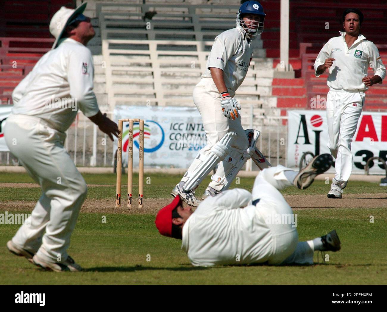 Canada's second slip Zubin Sarkari, on ground, drops the catch of ...