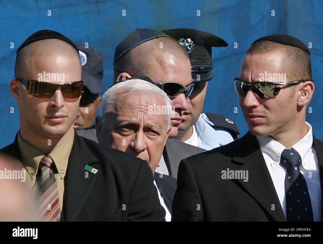Israeli Prime Minister Ariel Sharon, center, flanked by bodyguards arrives at the 31st annual ...