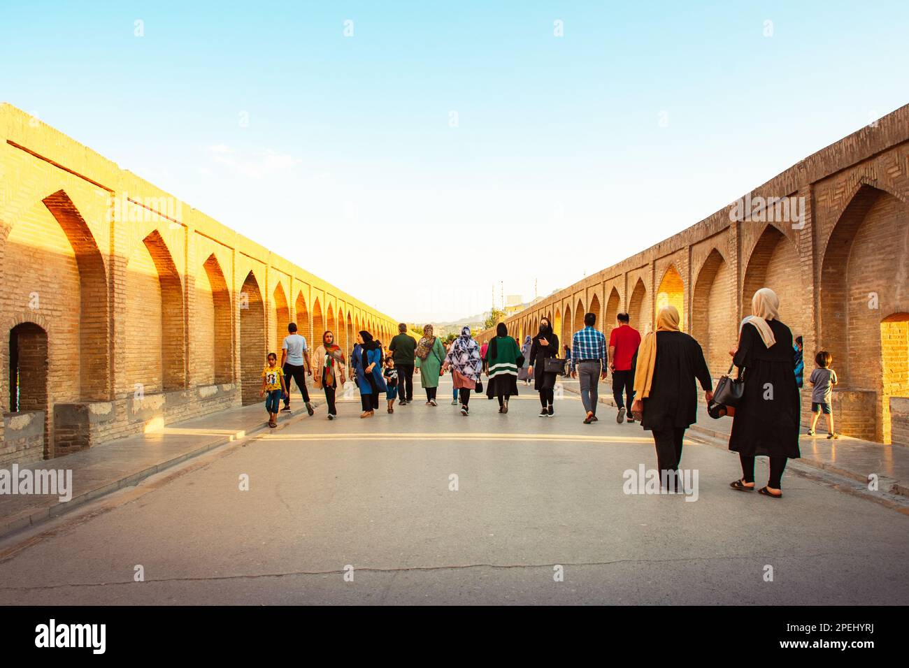 Isfahan, Iran - May 2022: people walk on Sio Se Pol or Bridge of 33 ...
