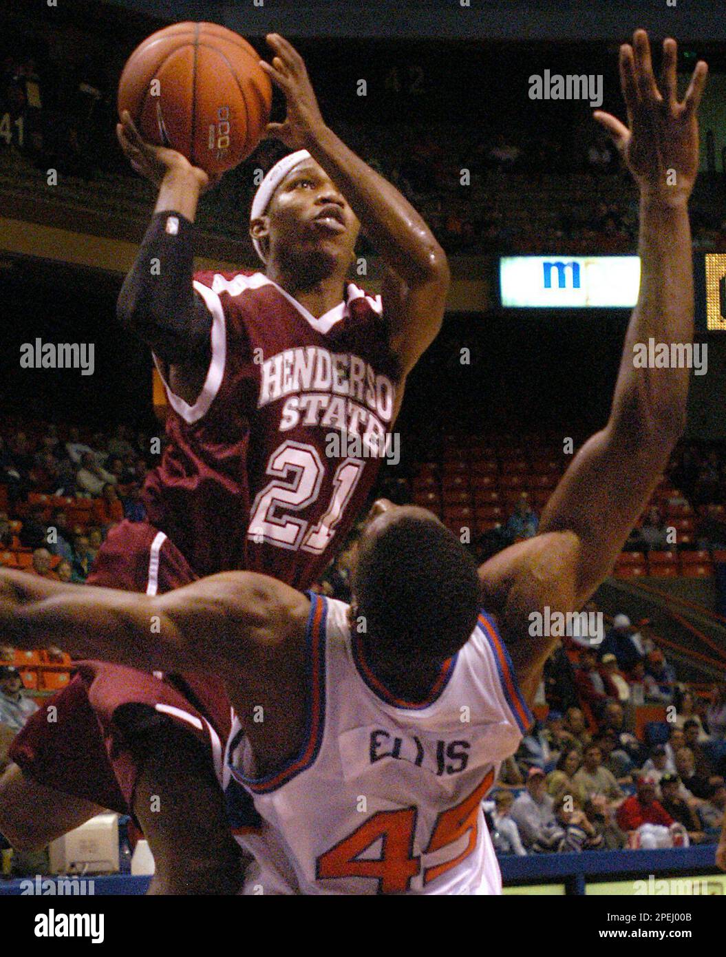 Henderson State guard Eddie Withers (21) shoots over the top of Boise ...