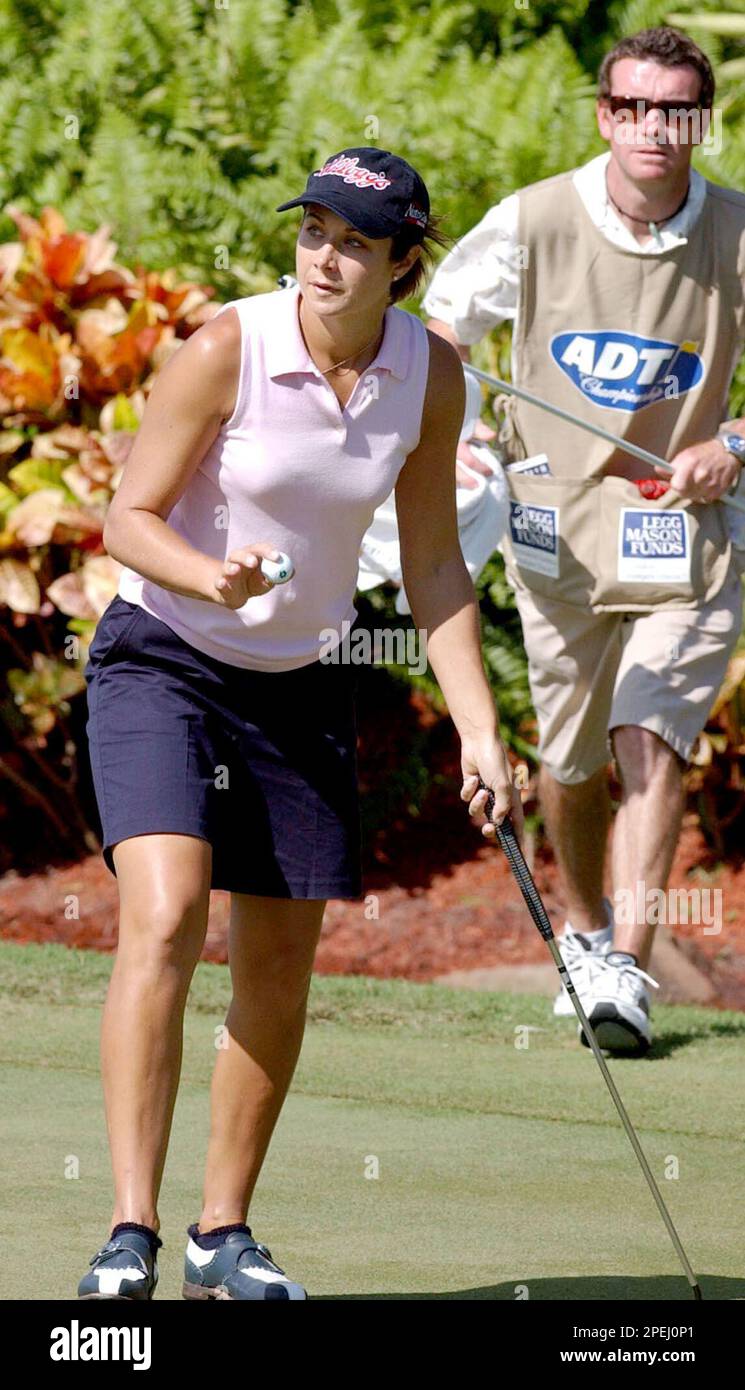 Laura Diaz of Amelia Island, Fla. picks up her ball after shooting a ...