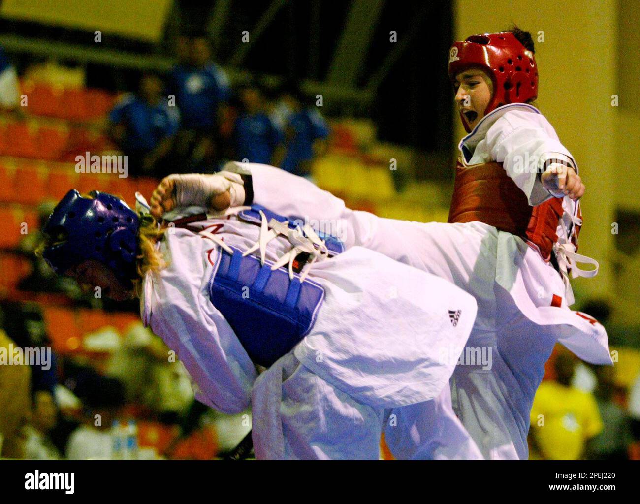 USA's Brittany Nikrolyn, right, kicks at Canada's Dayna Harsted, during ...