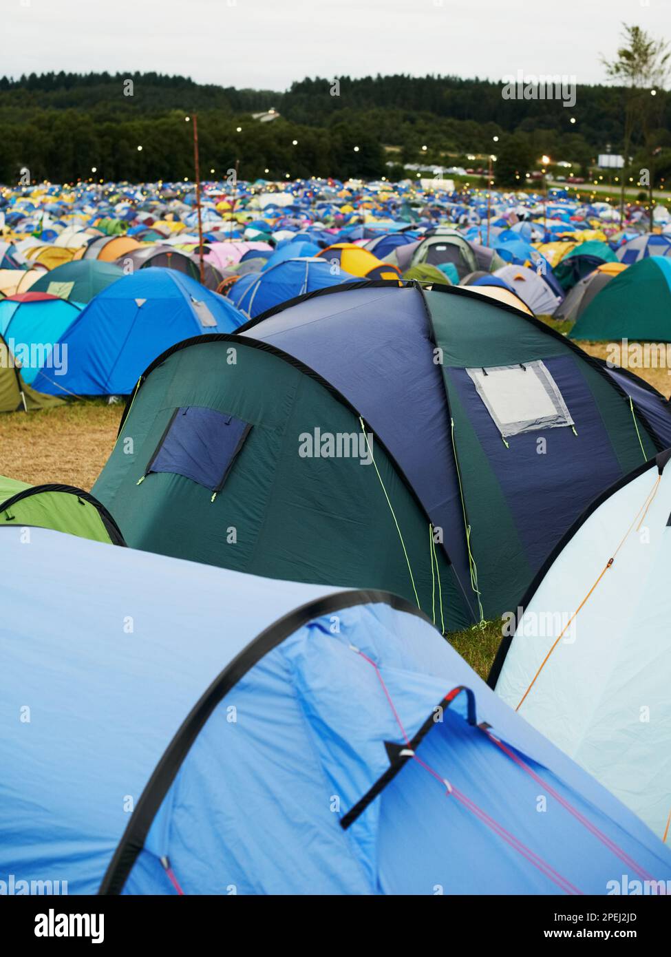 Full house at the festival. Landscape shot of tents on a field at an ...