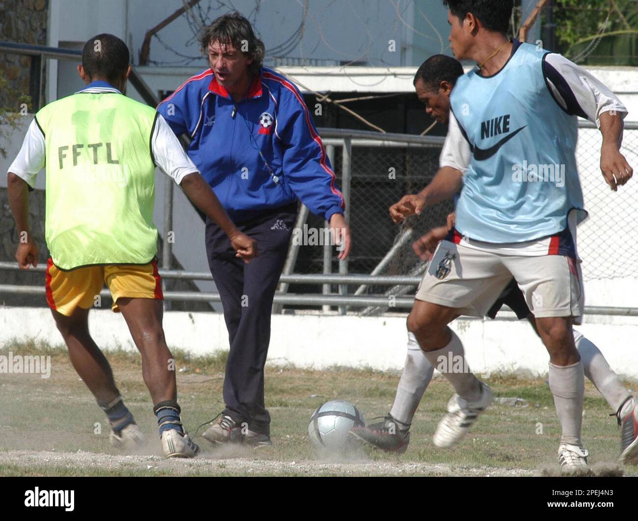 East Timor's football coach Jose Luis, center, of Portugal trains ...