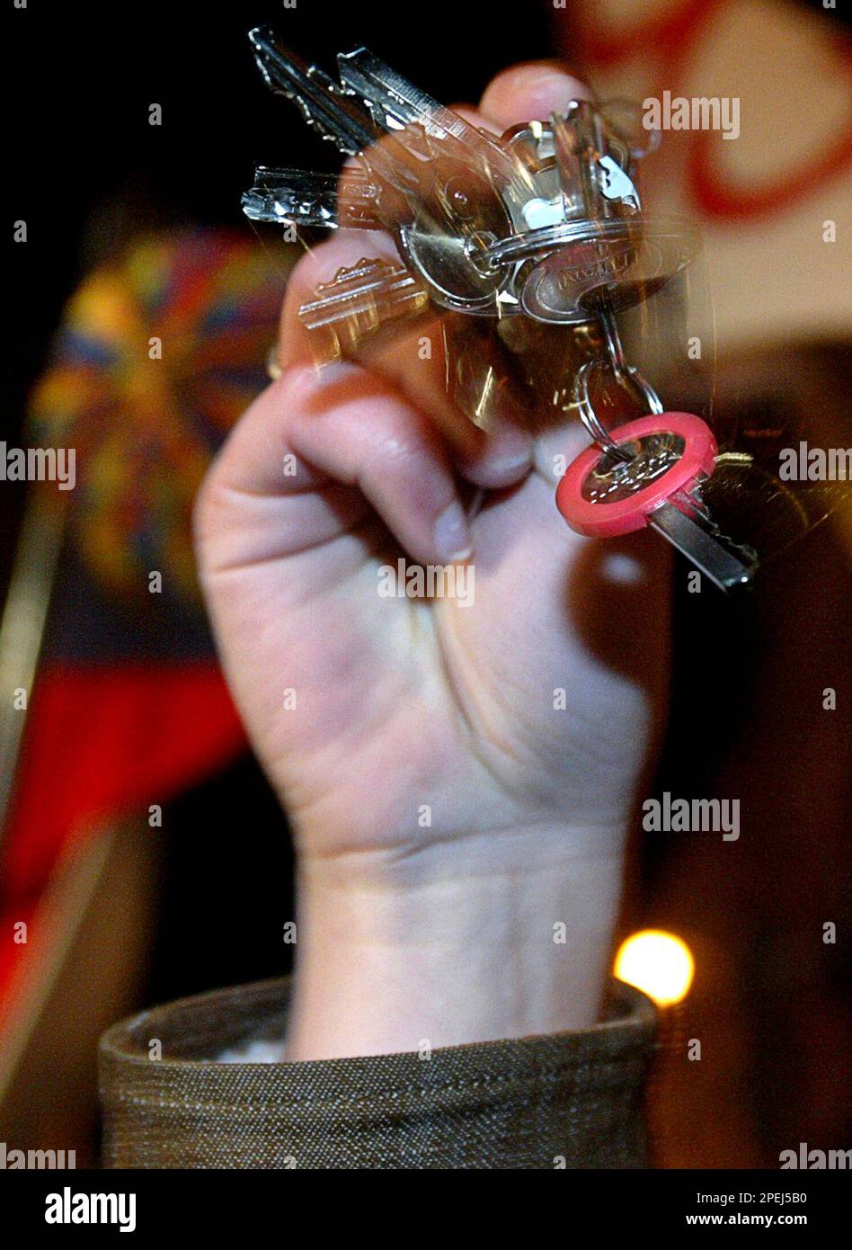 A marcher jingles keys during a march commemorating the 15th ...