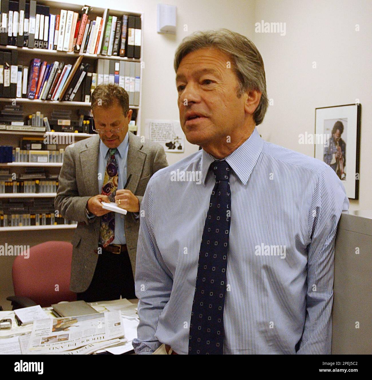 WJAR-TV news reporter Jim Taricani talks with a fellow reporter (not in ...