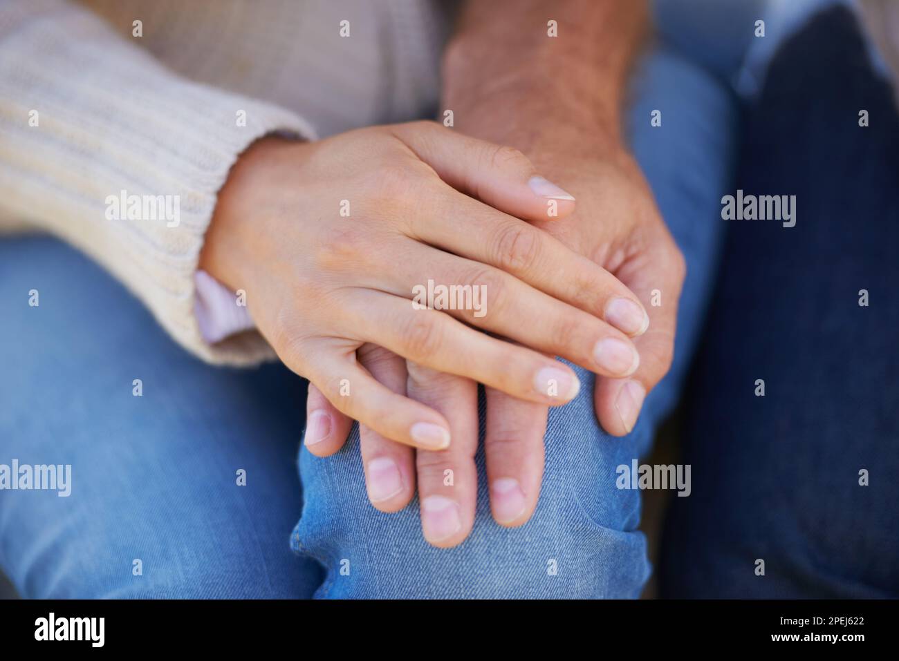 A loving hand. Cropped image of a woman placing her hand affectionately ...