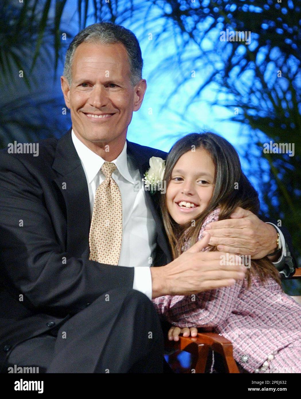 Miami-Dade County Mayor Carlos Alvarez, left, smiles as he embraces his ...