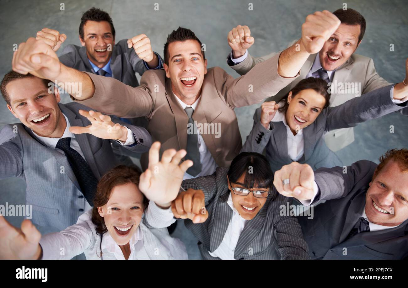 Winners. Top view of a group of young business executives celebrating ...