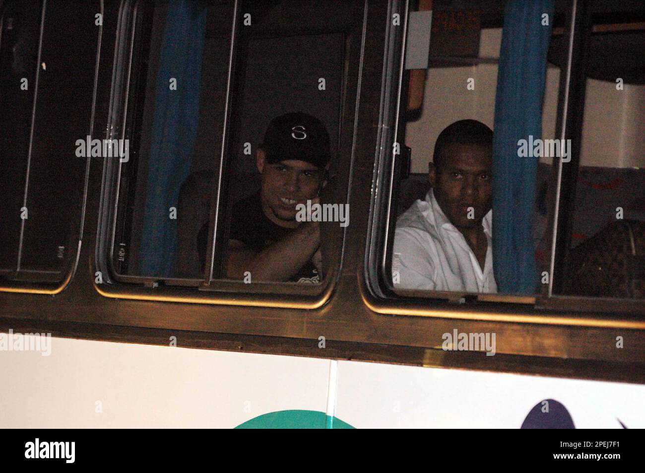 Ronaldo,left, player of Brazilian soccer team smiles inside the bus ...