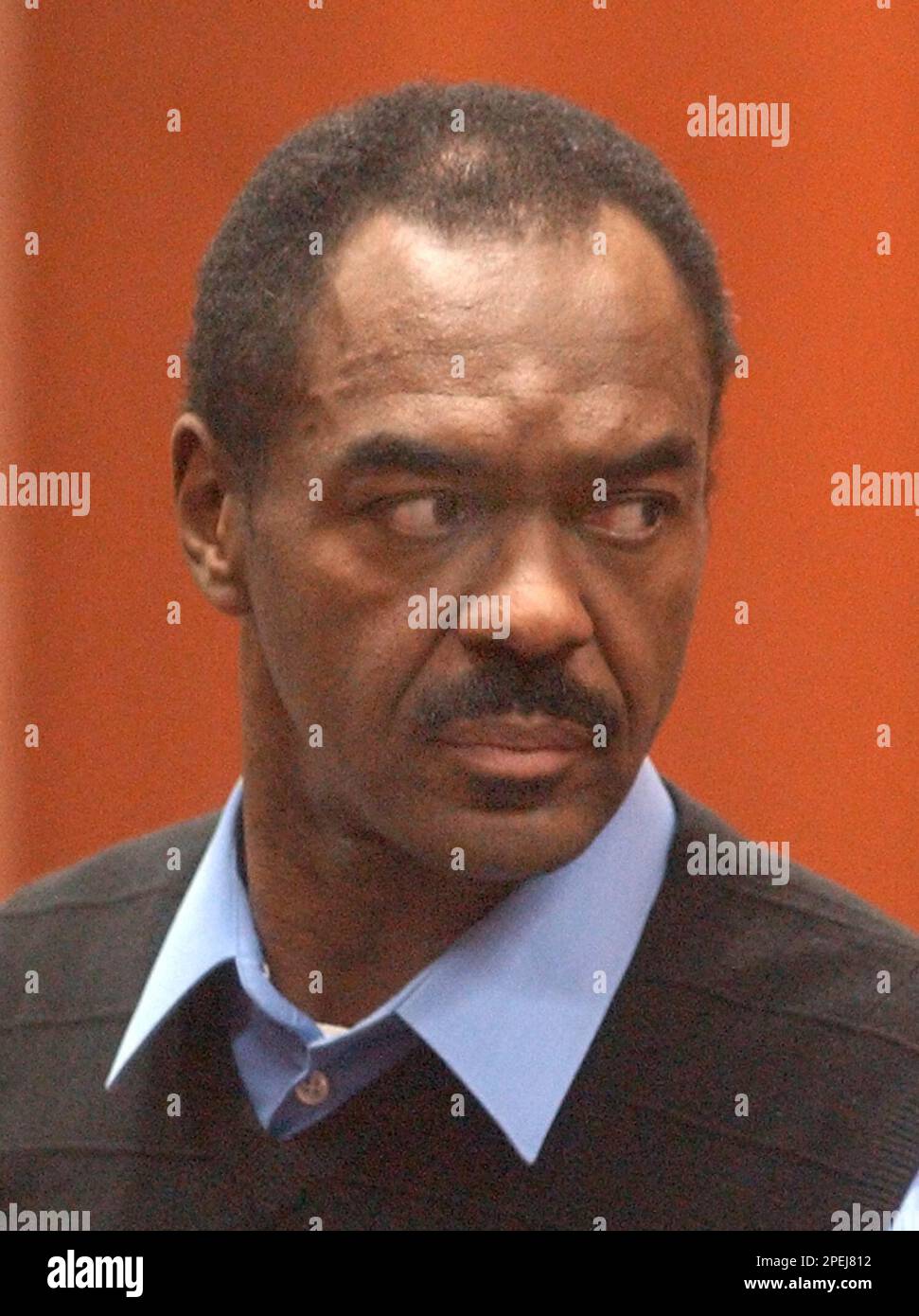 Convicted killer Coral Eugene Watts looks back to the trial audience as ...
