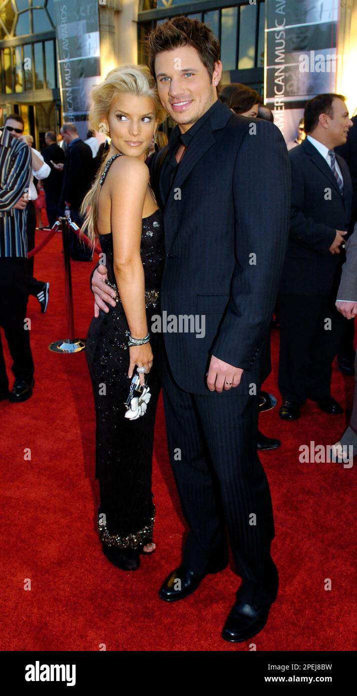 Jessica Simpson, left, and husband Nick Lachey arrive for the 32nd ...