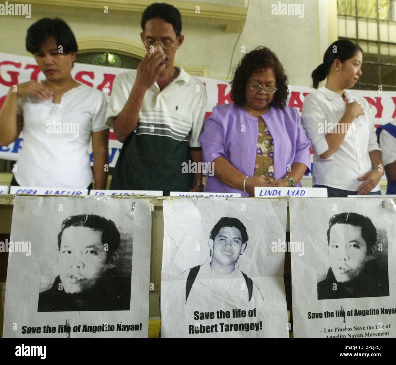 Activist and community leaders pray for the safe release of Filipino ...