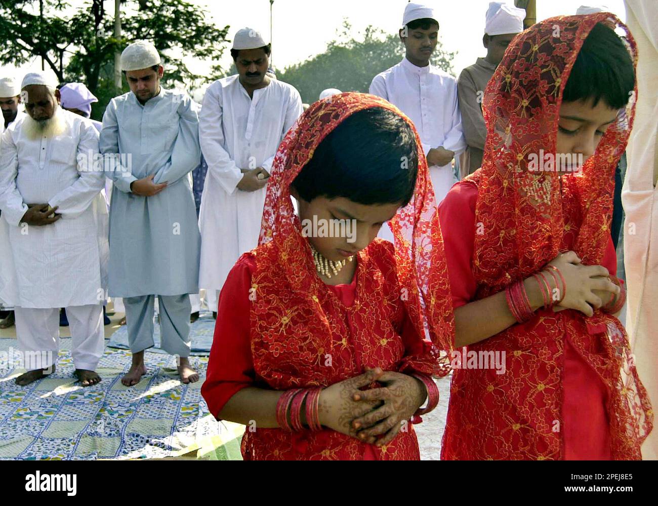 Two Muslim girls offer prayers in Calcutta, India, Monday, Nov. 15 ...