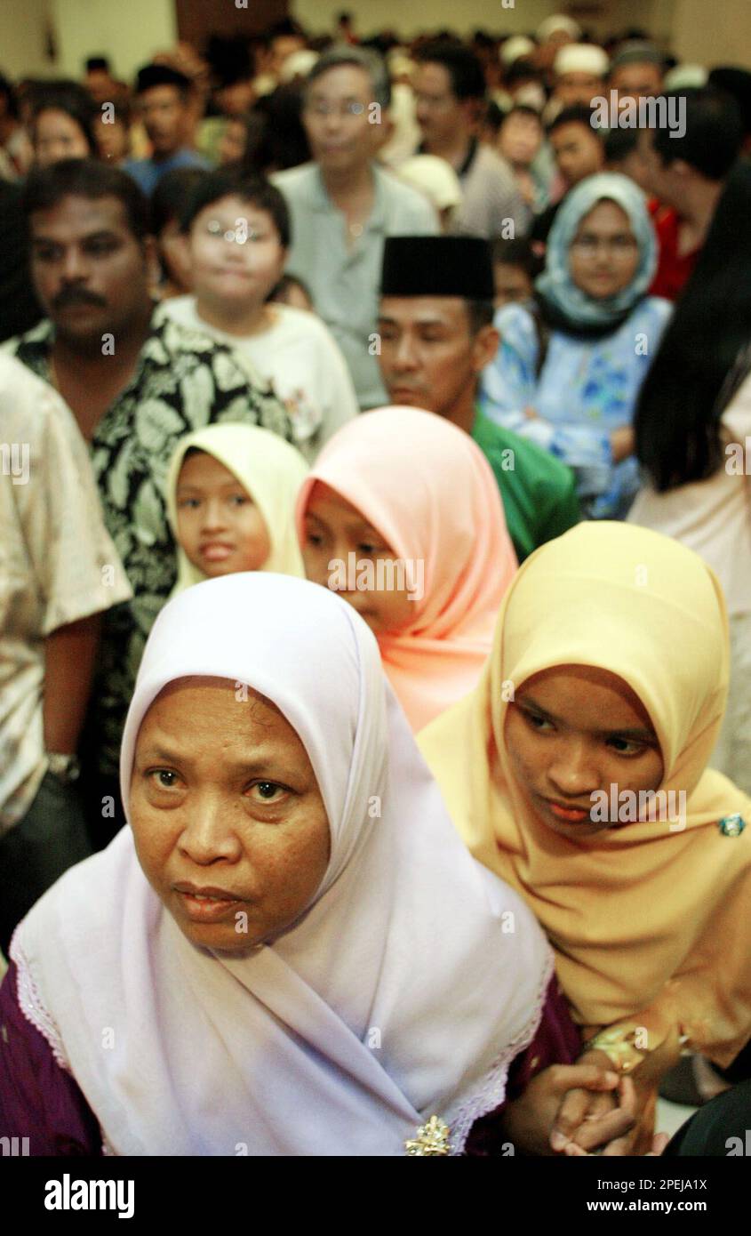 Malaysians line up to greet Prime Minister Abdullah Ahmad Badawi during ...