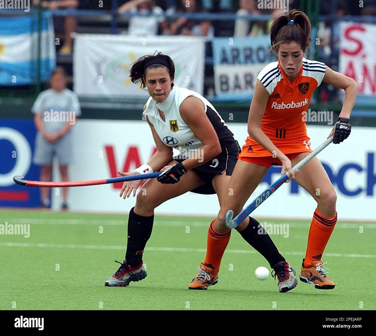 Naomi Van As , right, of Netherlands, watches the ball with Tina ...