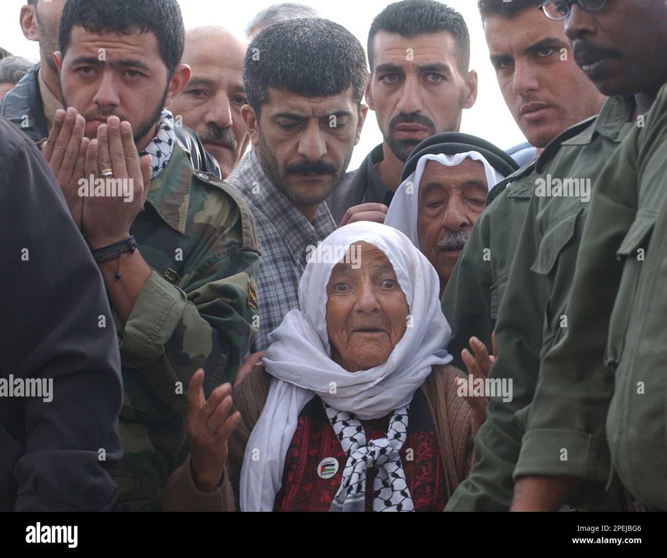 People pray at the grave of former Palestinian leader Yasser Arafat on ...