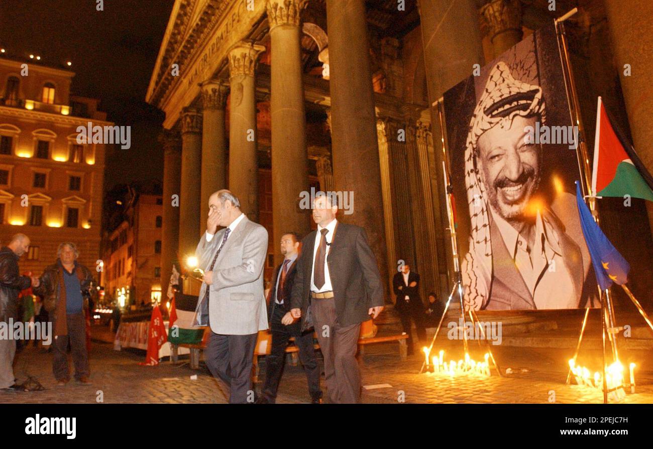 Palestinian representative in Italy Nemer Hammad, at center with gray ...