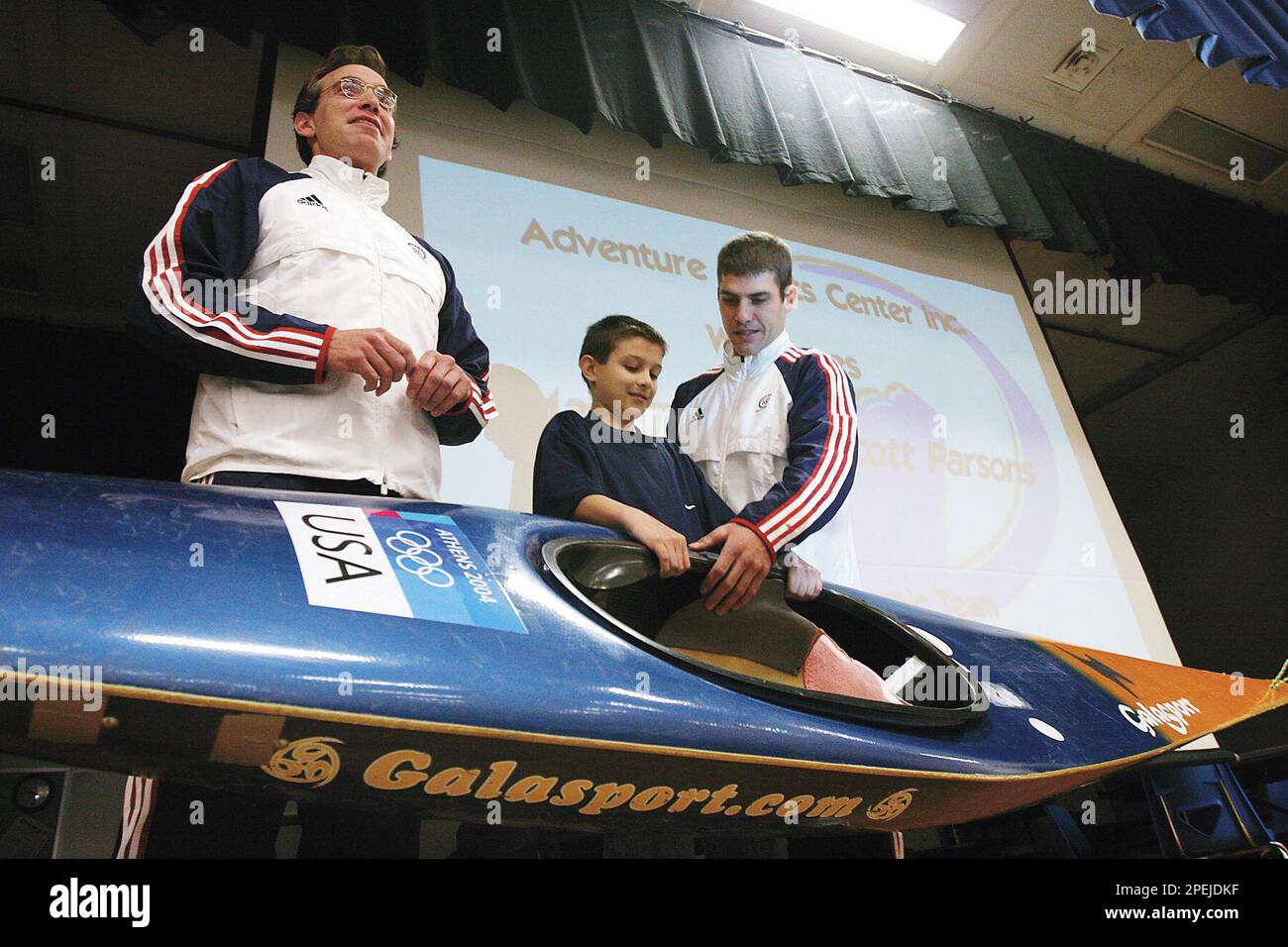 Olympic athlete Scott Parsons, right, helps 6th grader Adam Beitzel ...