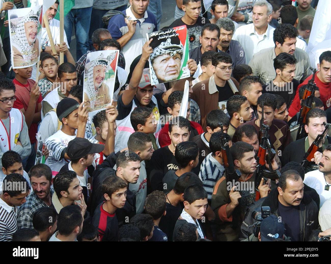 Palestinians participate in a rally to honor Palestinian leader Yasser ...