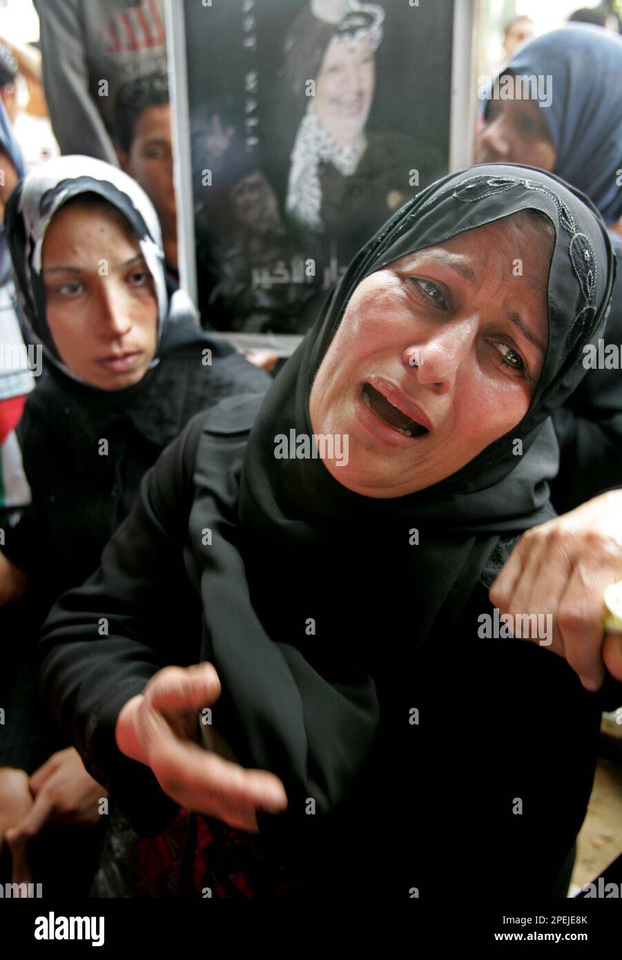 A Palestinian woman reacts in Gaza City, Thursday, Nov. 11, 2004, after ...