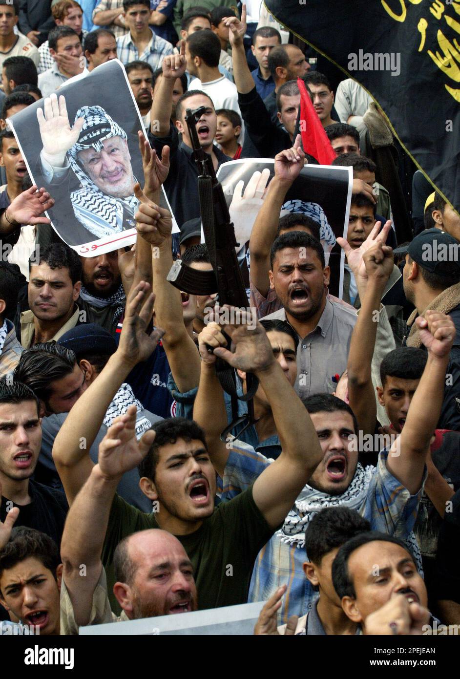 Palestinian men chant slogans during a demonstration at Yasser Arafat's ...