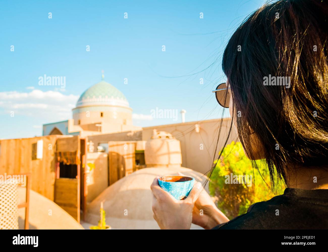 Yazd, Iran - 19th june, 2022: female caucasian tourist drink persian ...