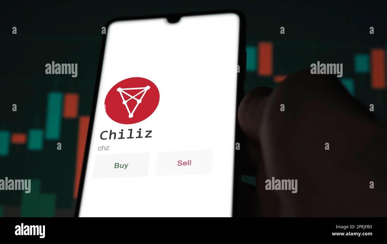 April 11 2023 London UK. An investor analyzing the chiliz coin on ...
